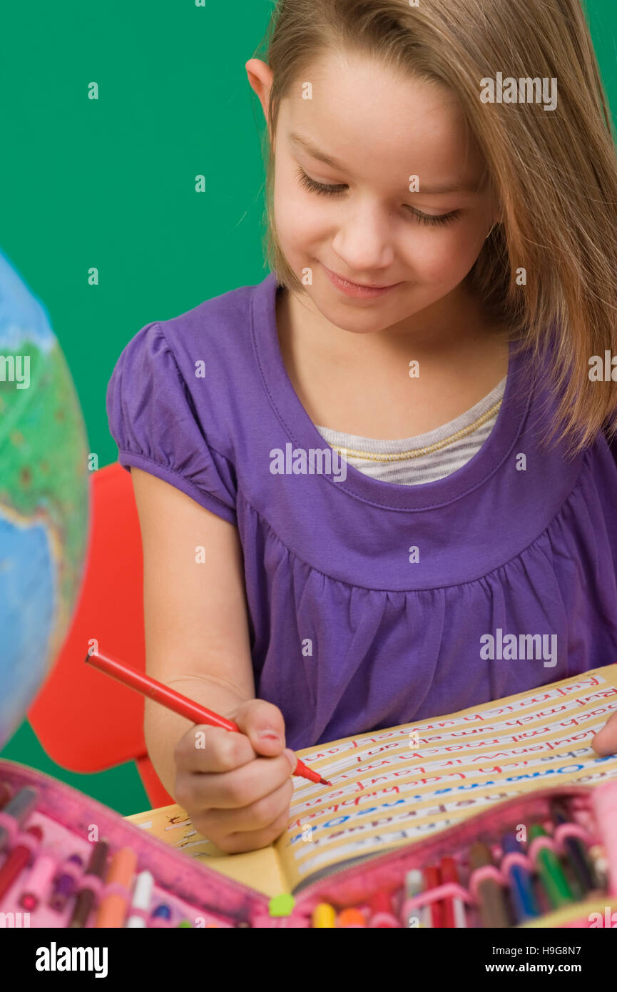 Girl, 6 years old, doing her homework Stock Photo - Alamy