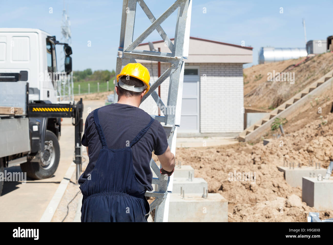 Construction worker at a construction site Stock Photo - Alamy