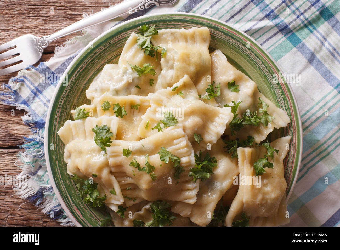German ravioli Maultaschen with spinach and meat close up on a plate ...