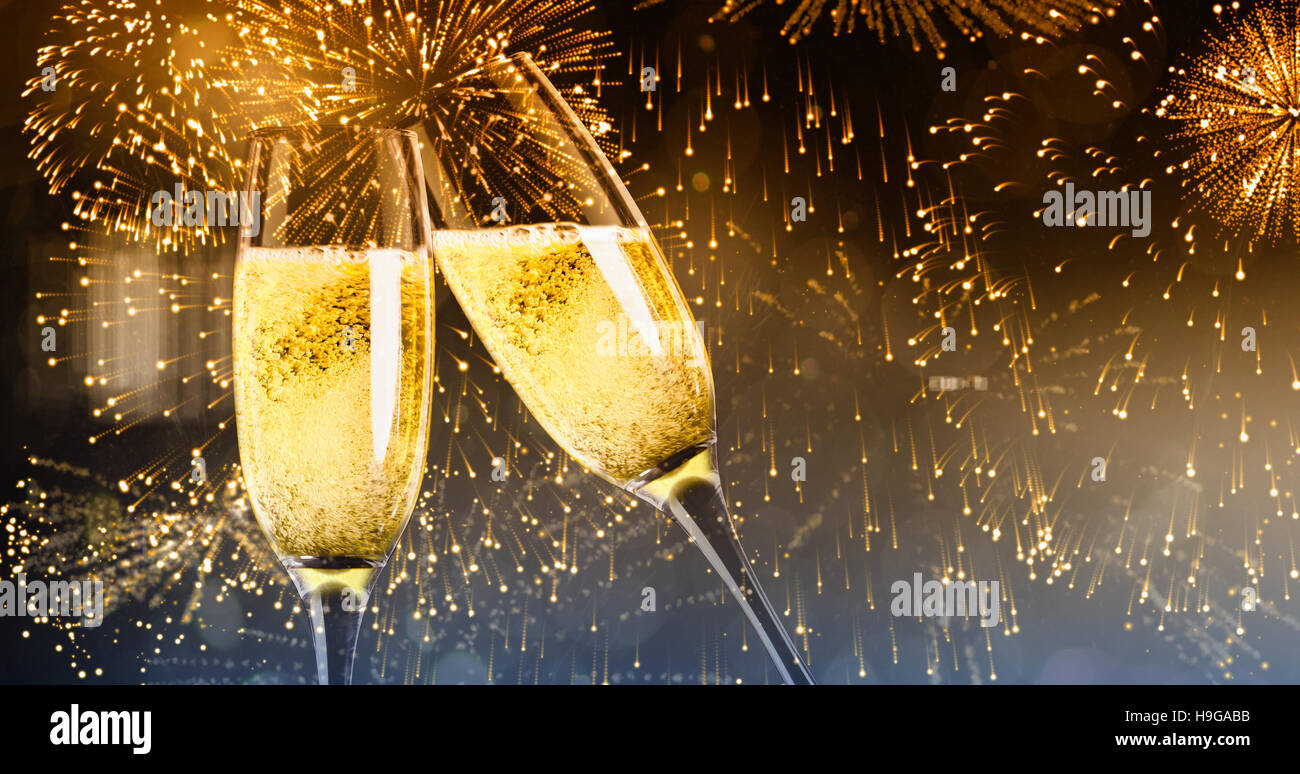 Composite image of champagne glasses clinking Stock Photo - Alamy