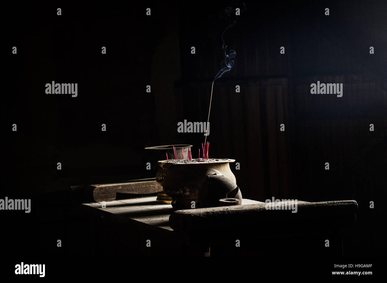 Burning of red joss sticks in Chinese temple Stock Photo - Alamy