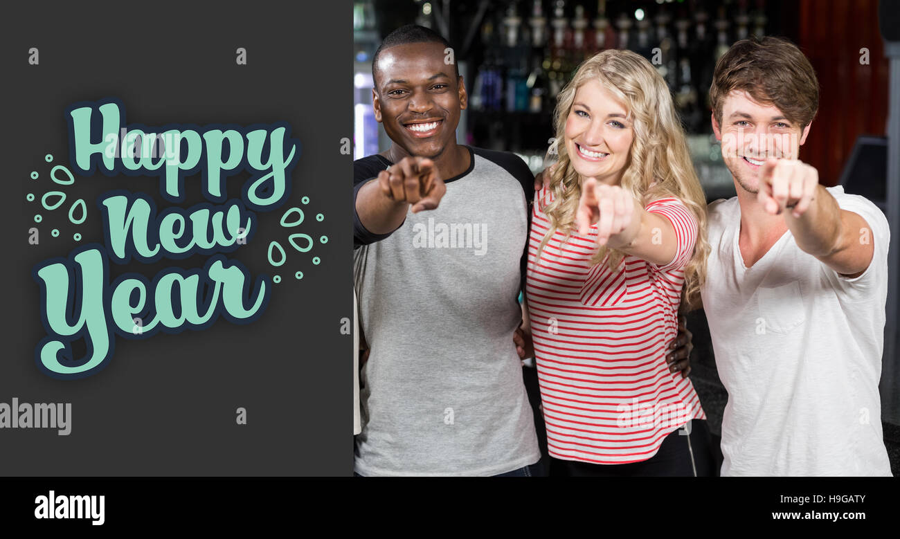 Composite image of portrait of friends pointing finger Stock Photo - Alamy