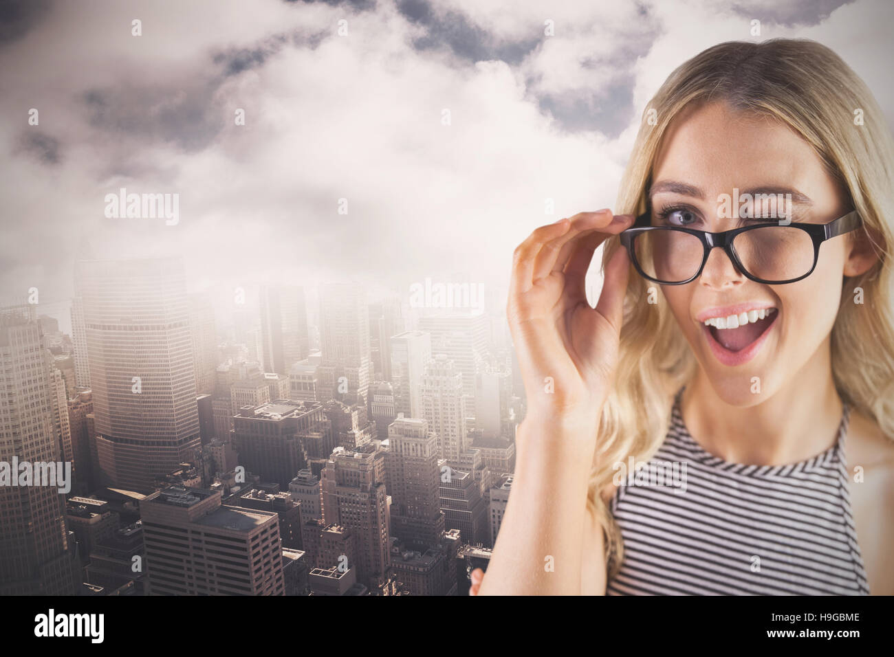 Composite image of gorgeous blonde hipster winking Stock Photo - Alamy
