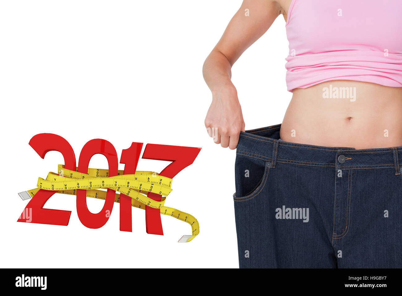 Composite image of mid section of beautiful females body in old jeans ...