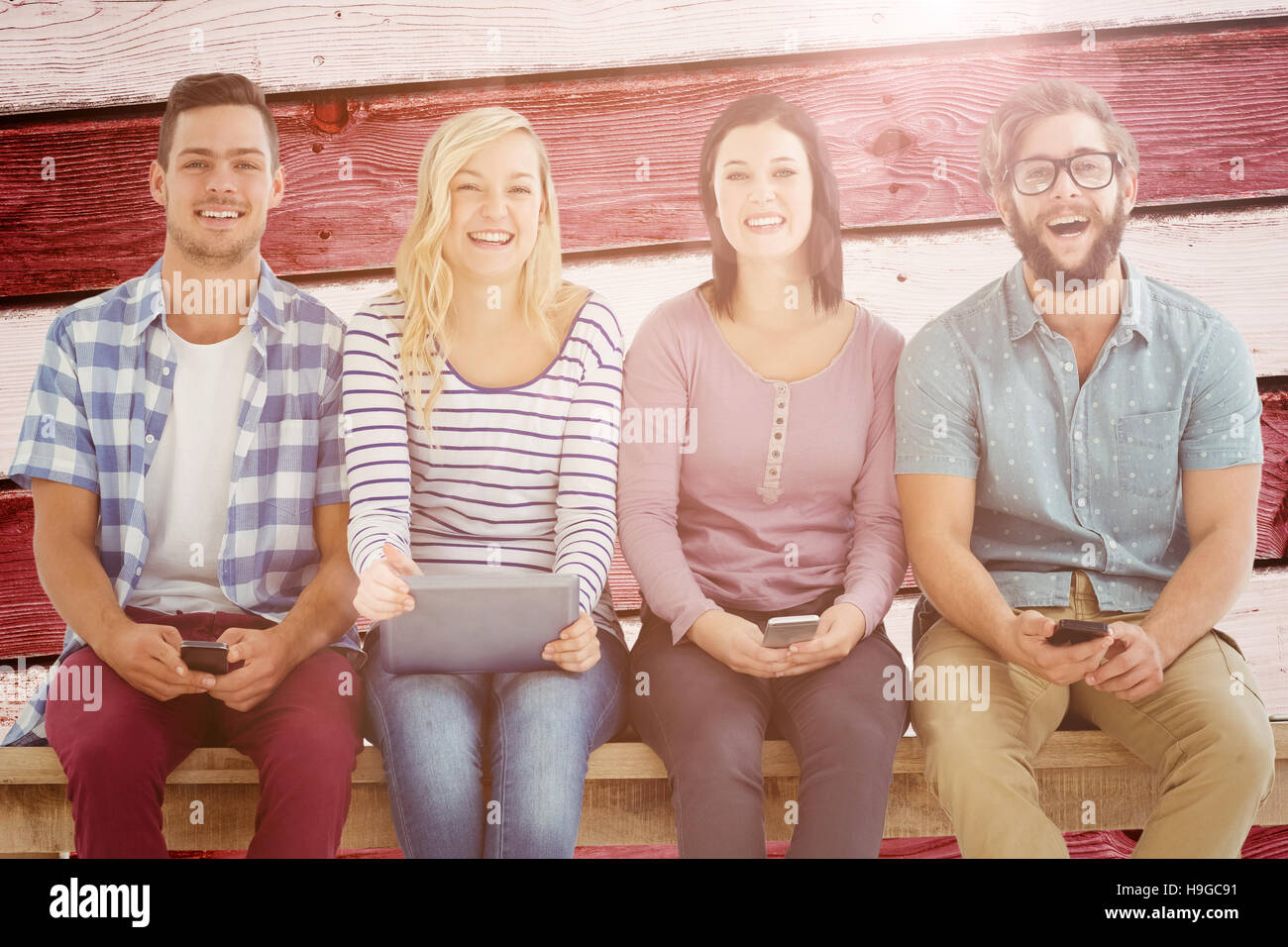 Composite image of portrait of smiling business people holding ...