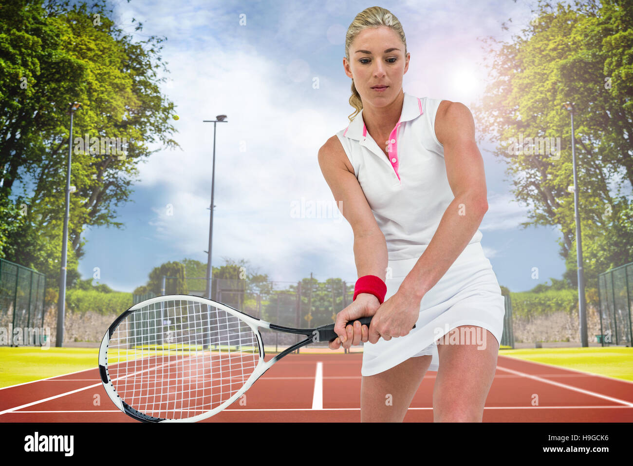 Composite image of athlete playing tennis with a racket Stock Photo - Alamy