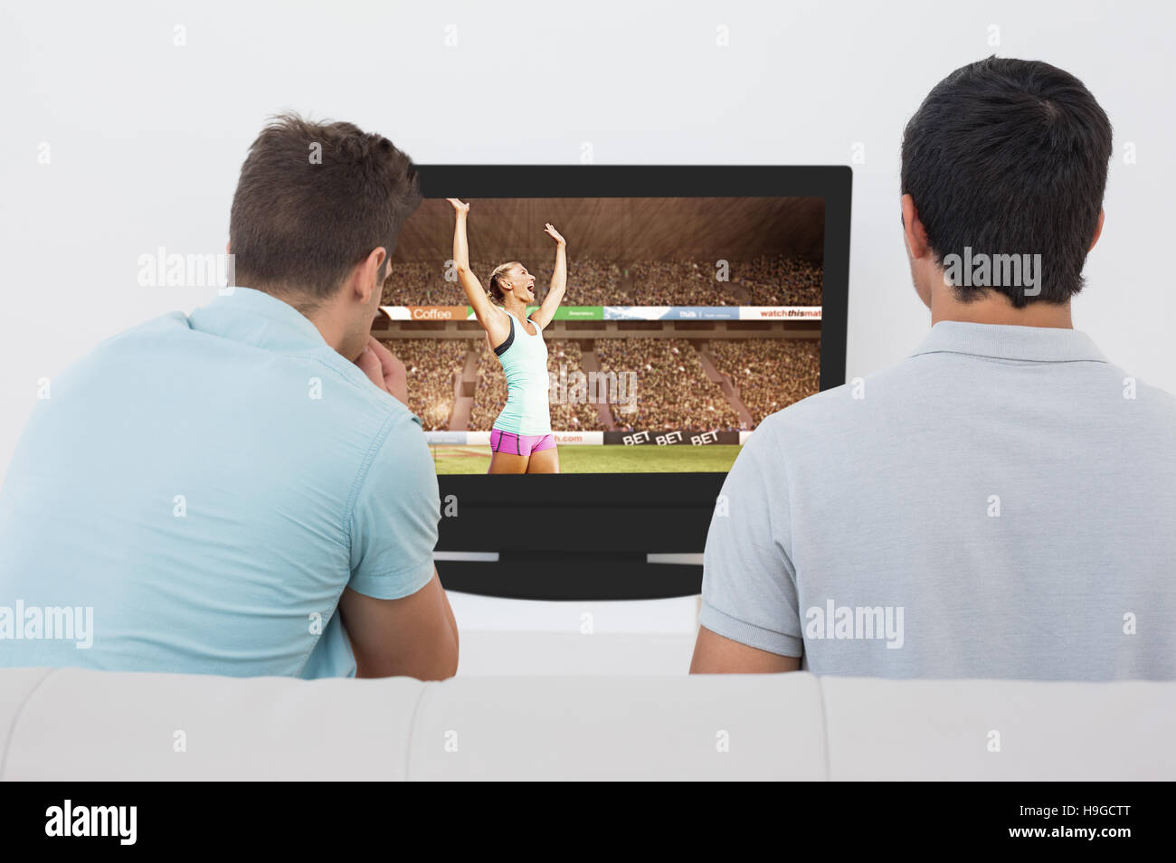 Woman watching man celebrating success hi-res stock photography and ...