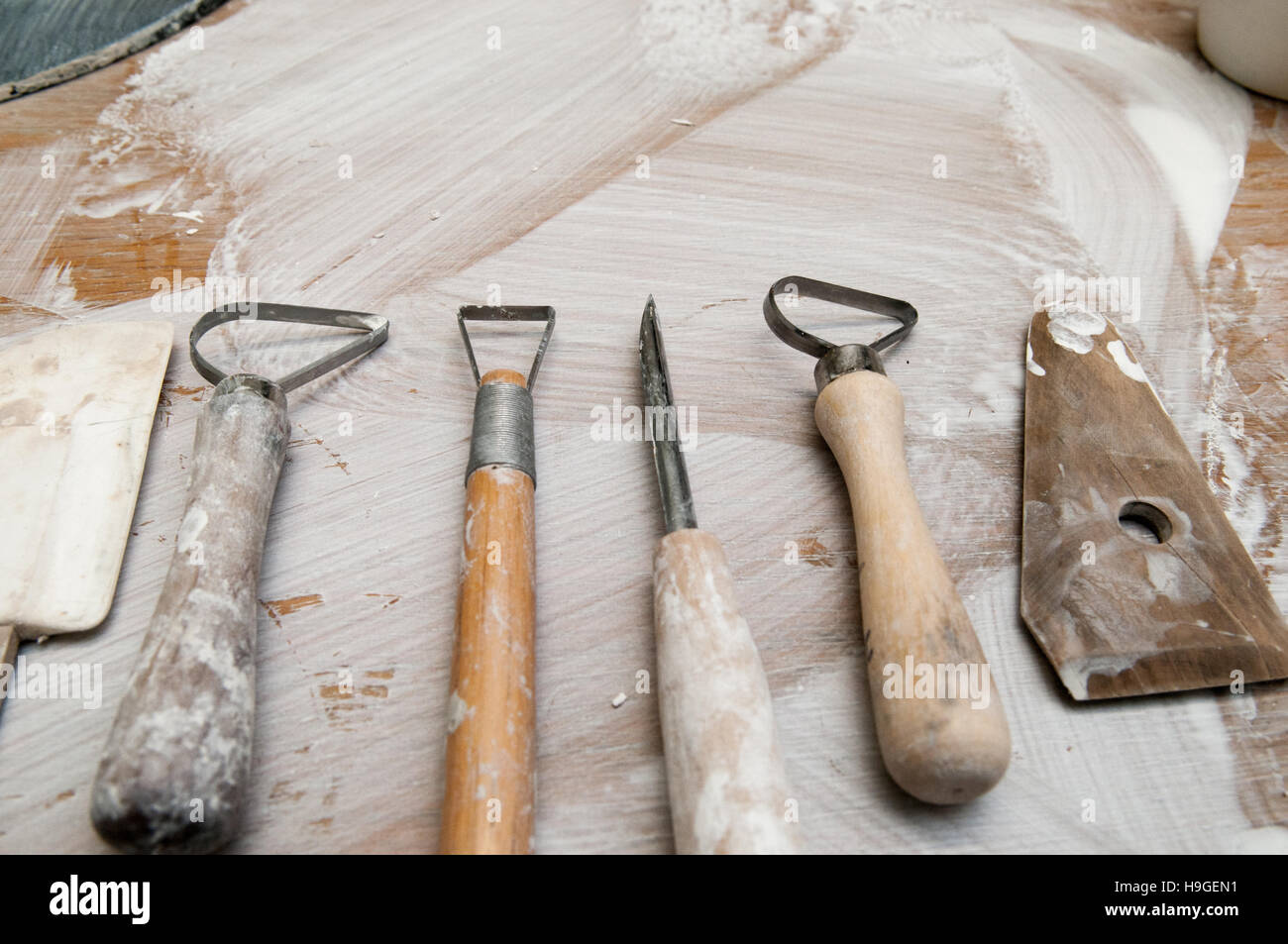Work tools in a messy ceramics workshop, overhead view Stock Photo - Alamy