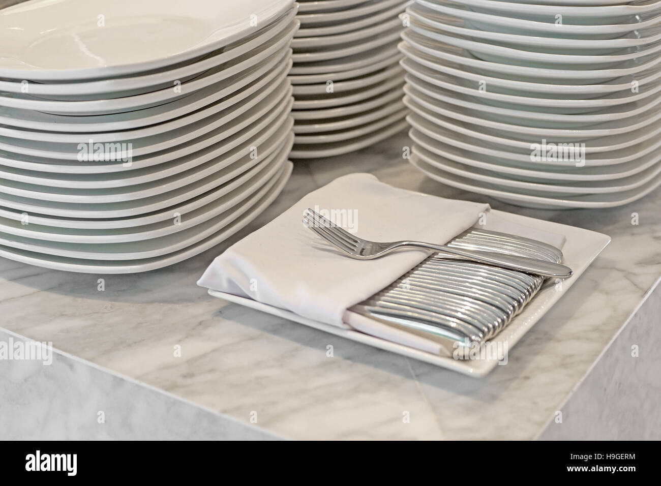 fork and empty white plate on buffet line Stock Photo - Alamy