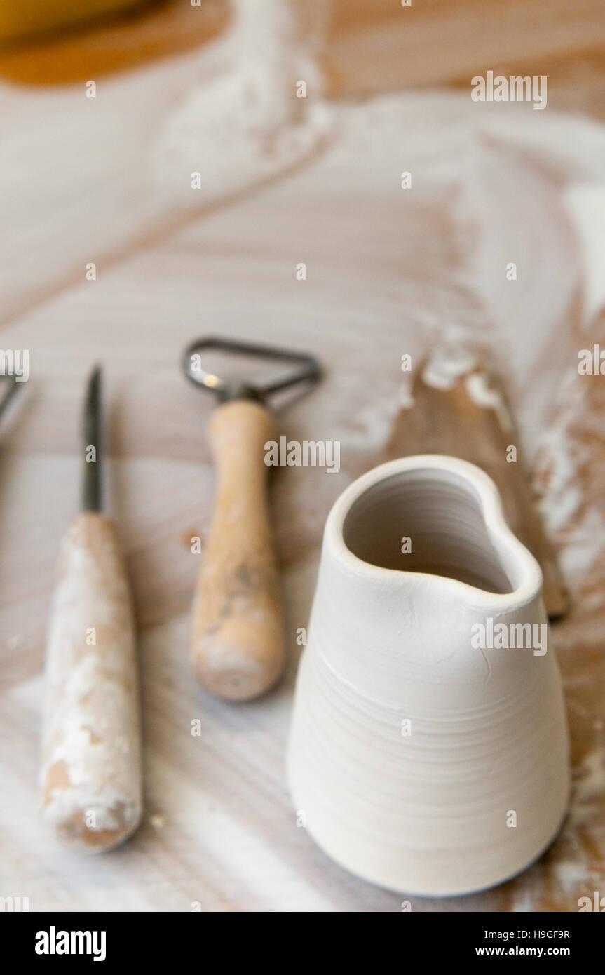 Work tools in a messy ceramics workshop, overhead view Stock Photo - Alamy