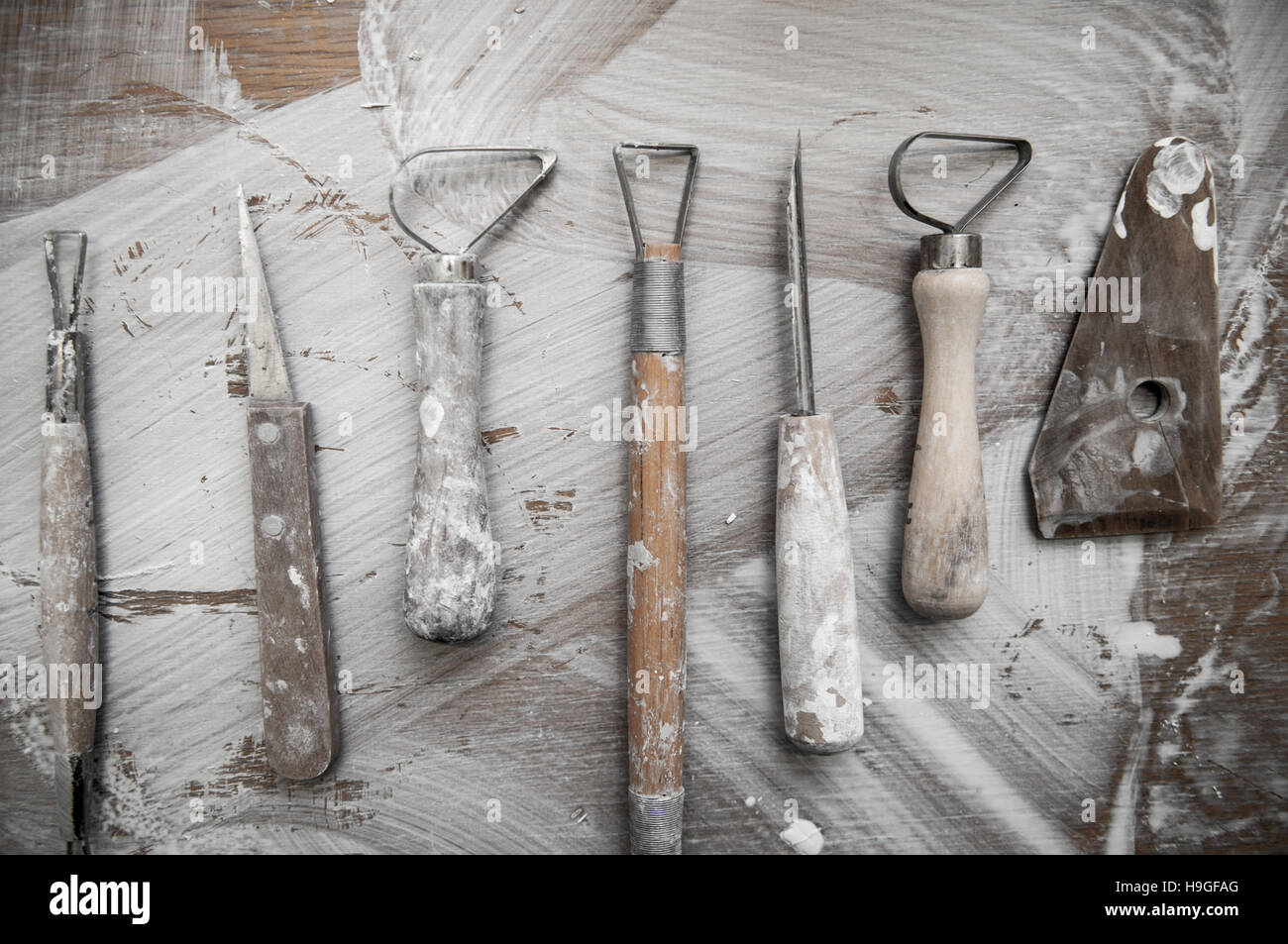 Work tools in a messy ceramics workshop, overhead view Stock Photo - Alamy