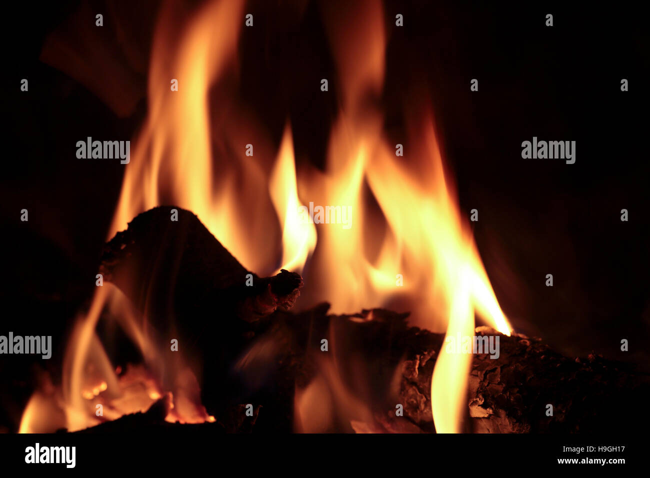 Flames of fire in a fireplace. Shooting horizontal with tones Orange ...