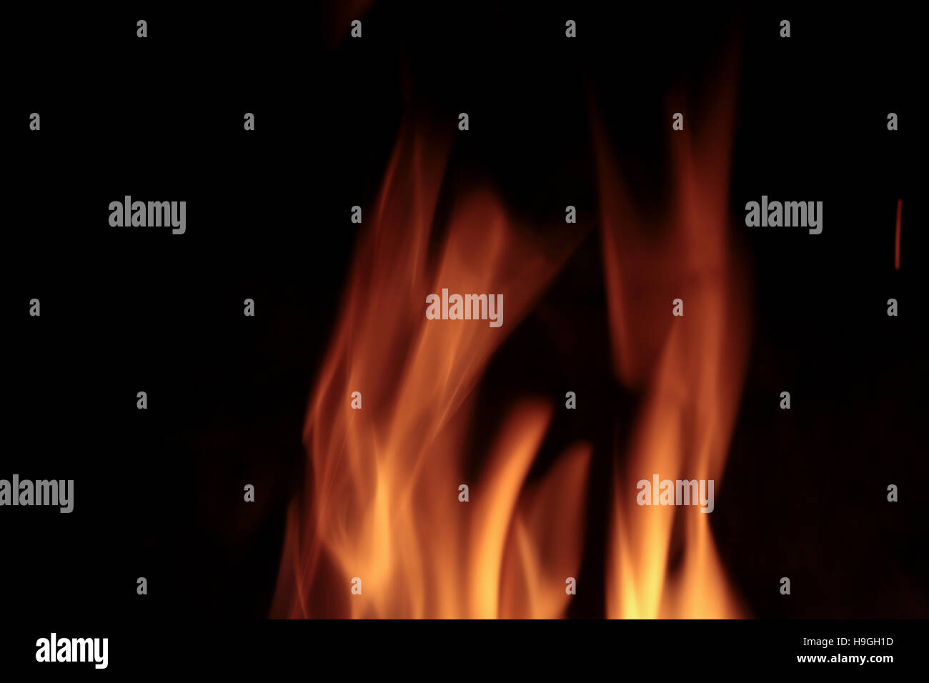 Flames of fire in a fireplace. Shooting horizontal with tones Orange ...