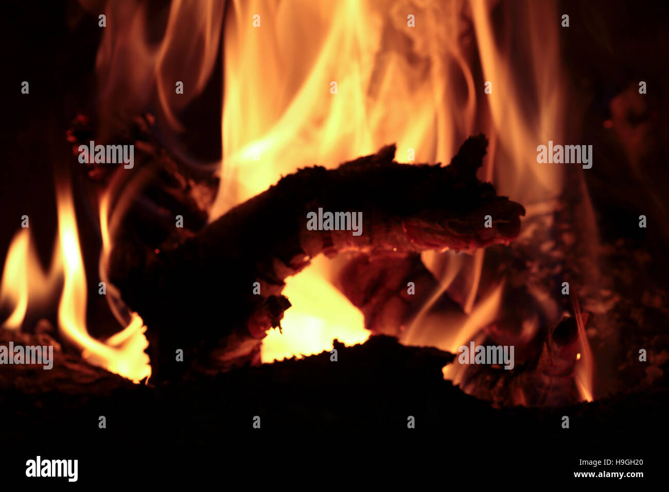 Flames of fire in a fireplace. Shooting horizontal with tones Orange ...