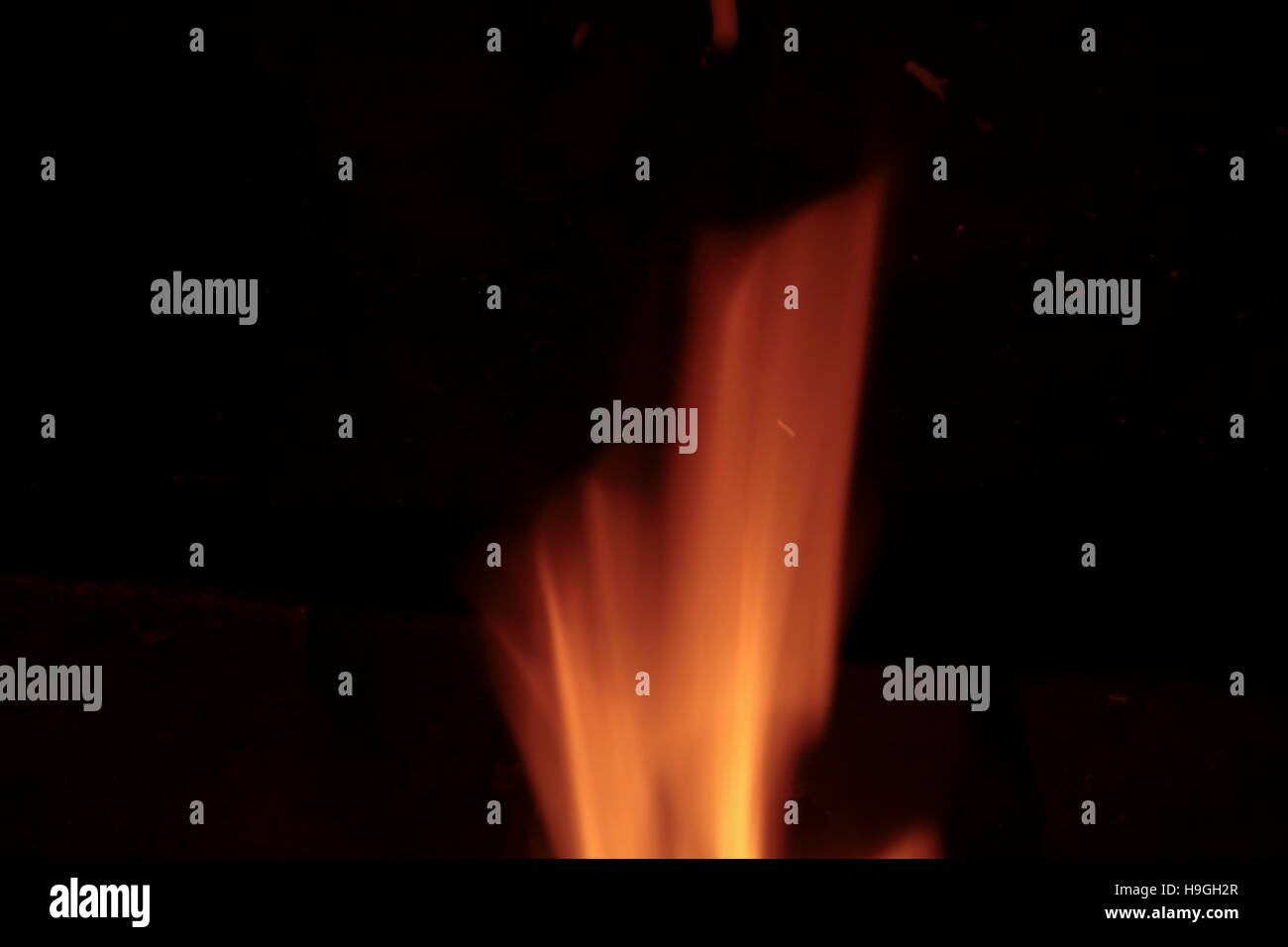 Flames of fire in a fireplace. Shooting horizontal with tones Orange ...