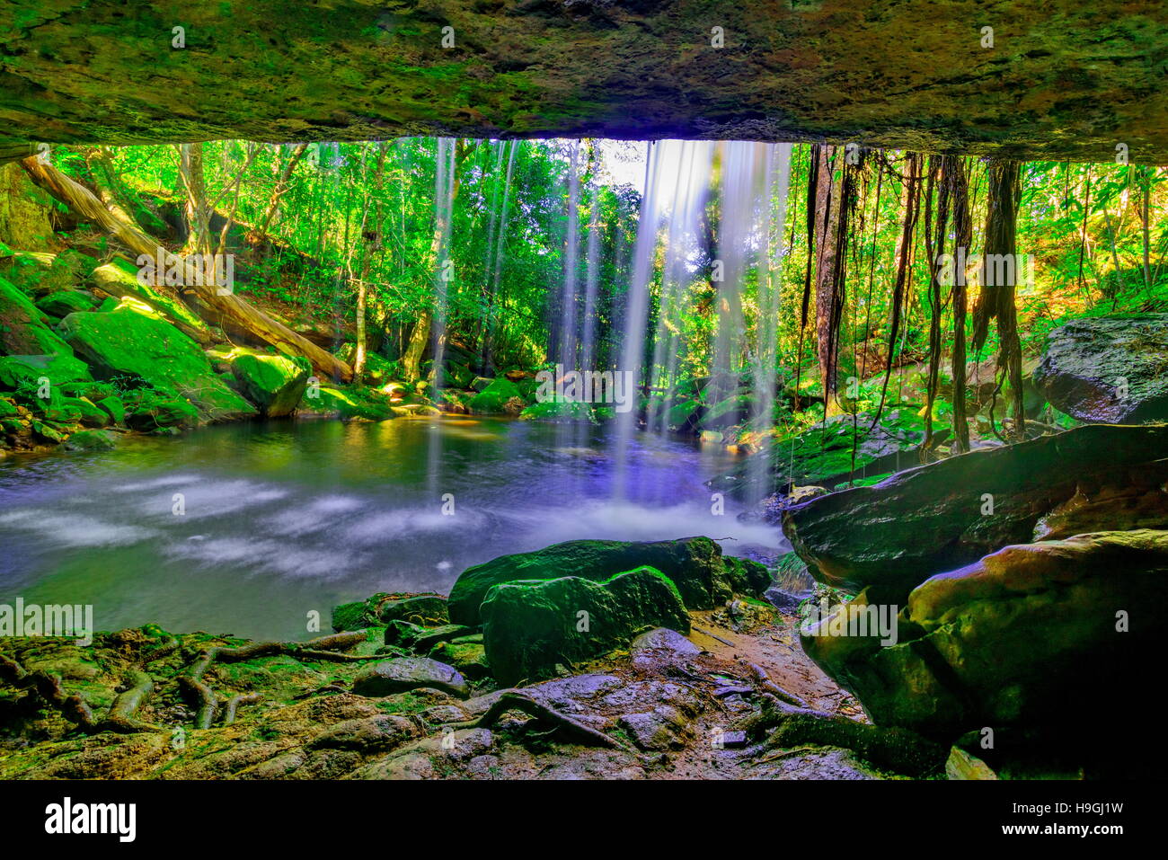 Cave behind a waterfall hi-res stock photography and images - Alamy