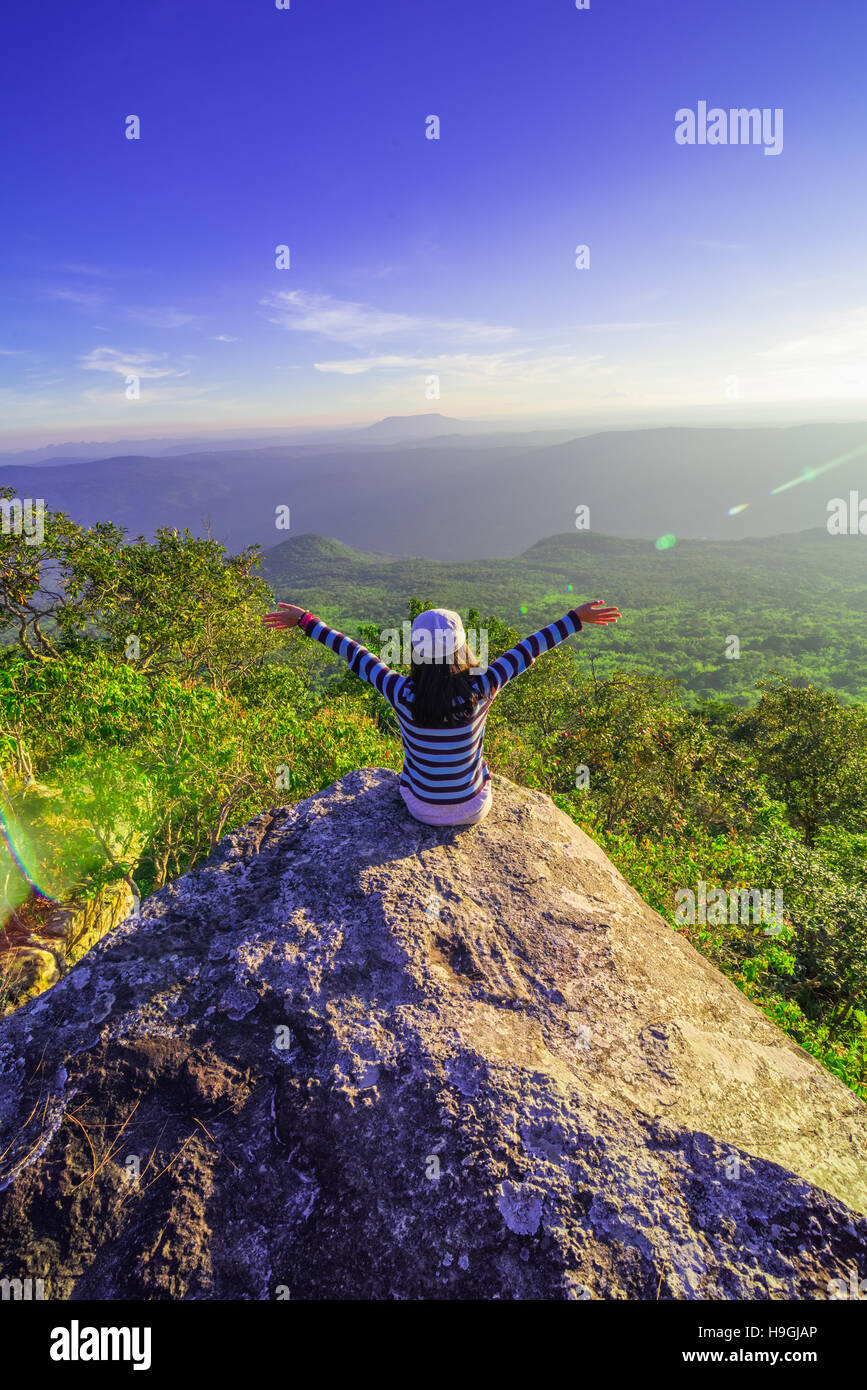 Woman with outstretched arms on a cliff hi-res stock photography and ...