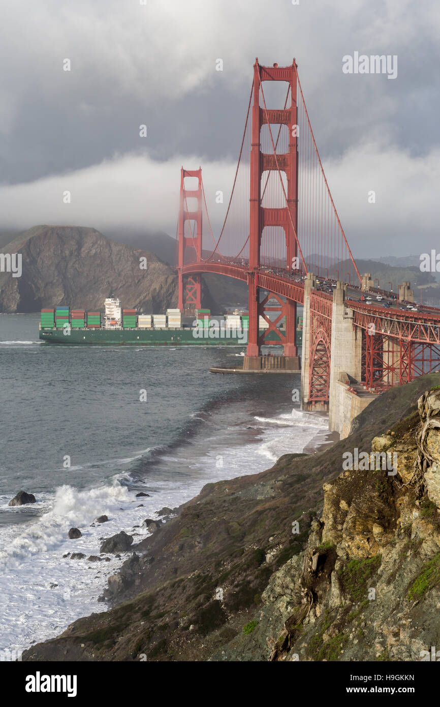 Cargo ship crossing the Golden Gate Bridge during a storm Stock Photo ...