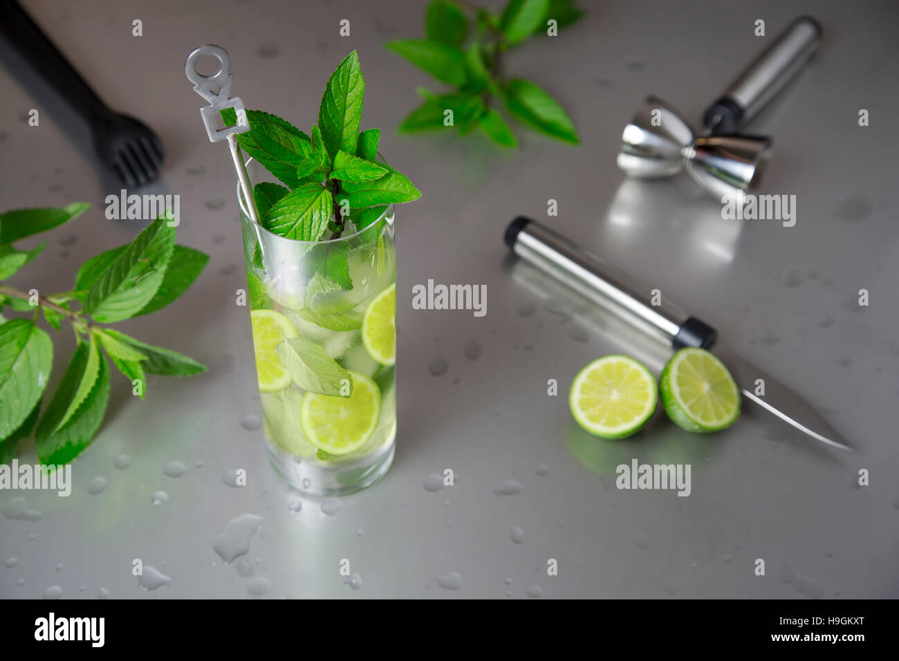 portrait of fresh mojito glass with barman tools Stock Photo - Alamy