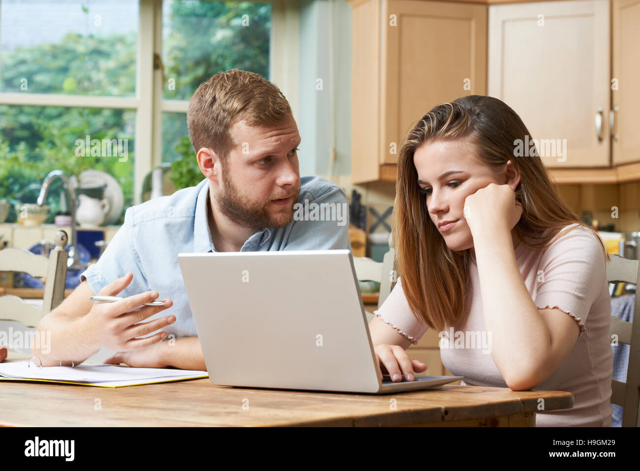 Male Home Tutor Helping Girl Struggling With Studies Stock Photo - Alamy