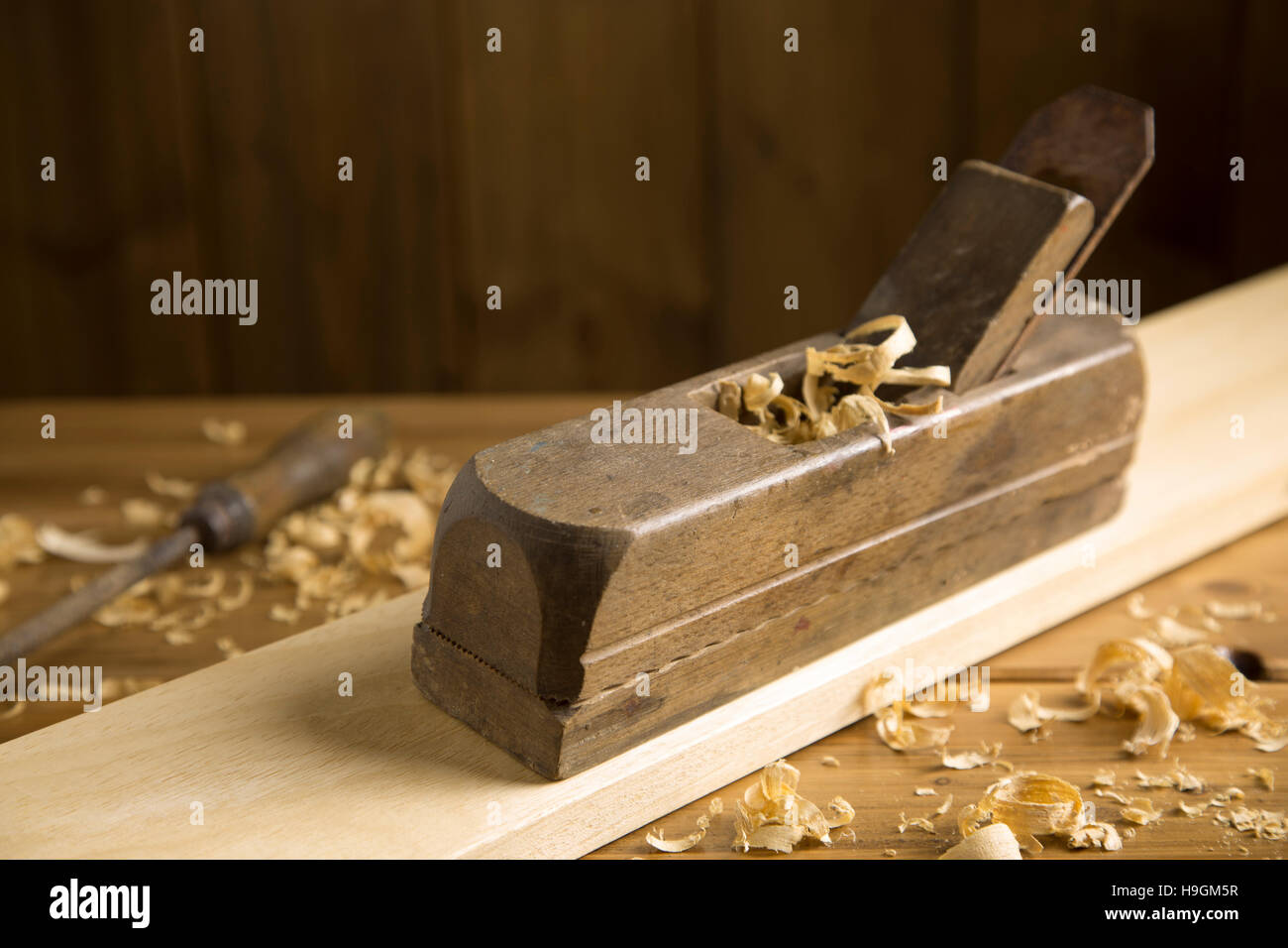 portrait of an old carpenter's plane "in action Stock Photo - Alamy