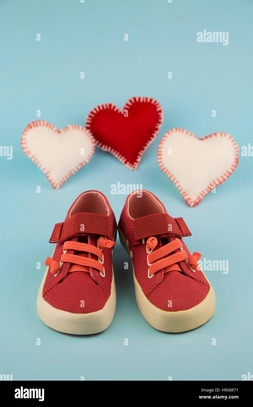 portrait of little girl shoes with hearts Stock Photo - Alamy
