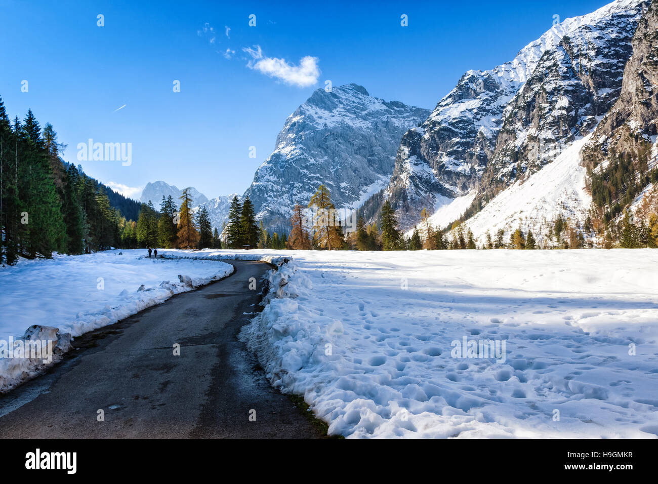 Path through early winter mountain landscape. Snow fall in the late ...