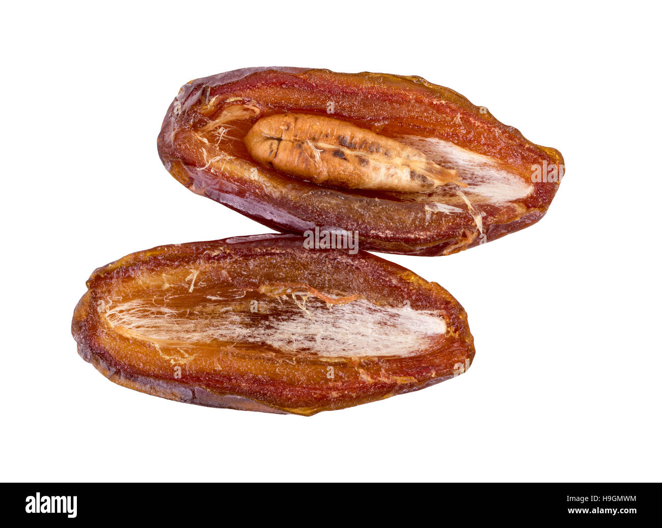 dried dates half two halves on white Stock Photo - Alamy