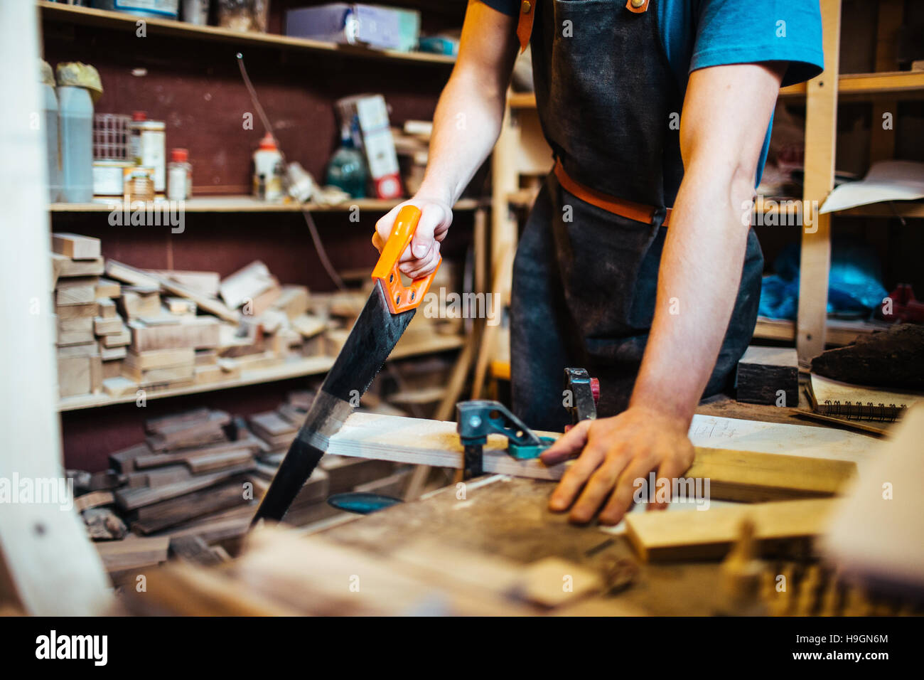 Sawing businessman hi-res stock photography and images - Alamy