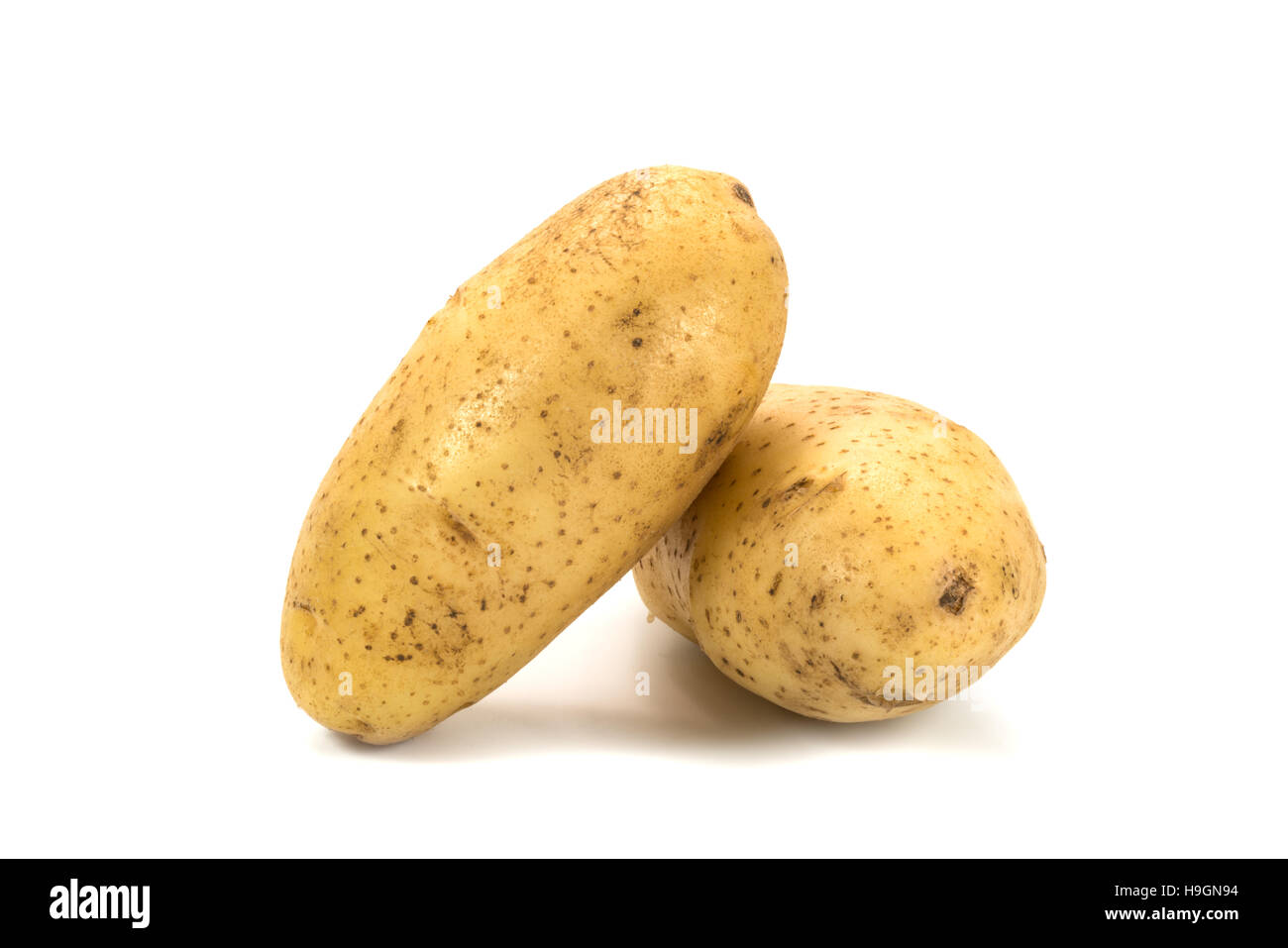 Closeup of fresh potatoes isolated on white background Stock Photo - Alamy