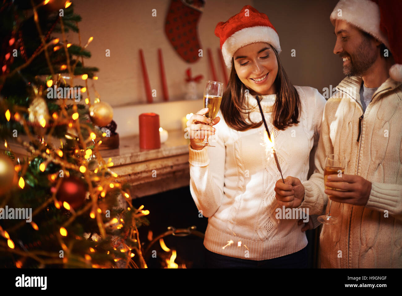 Cheerful couple celebrating winter holiday Stock Photo - Alamy