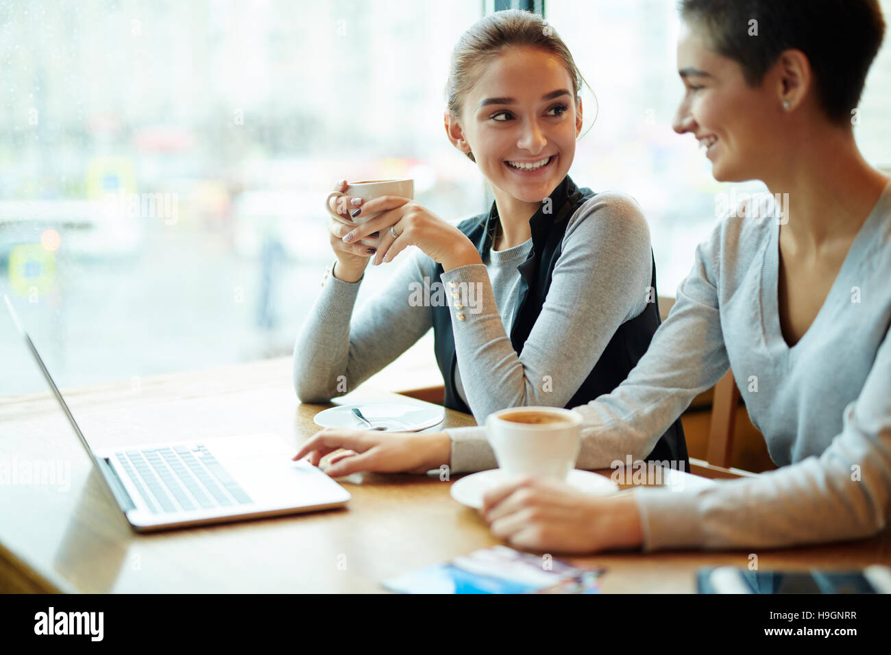 Two girls sitting in hi-res stock photography and images - Alamy