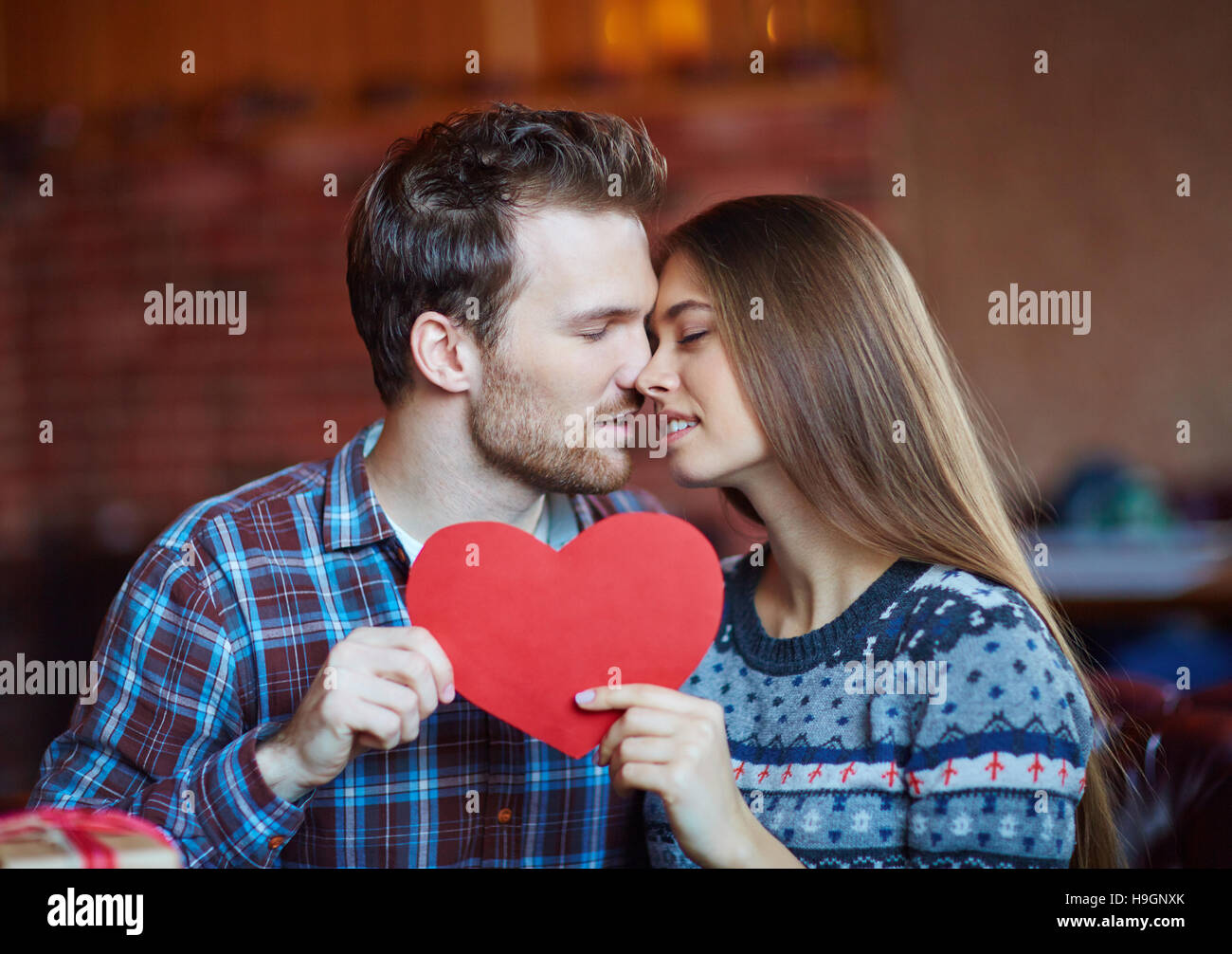 Sensual couple touching by noses Stock Photo - Alamy