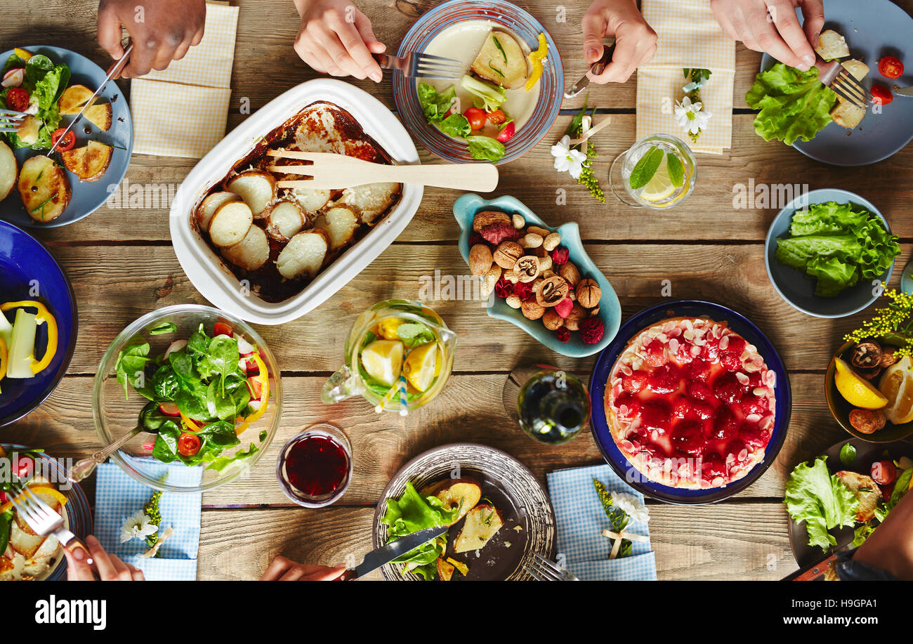 Human hands over festive table during dinner Stock Photo - Alamy
