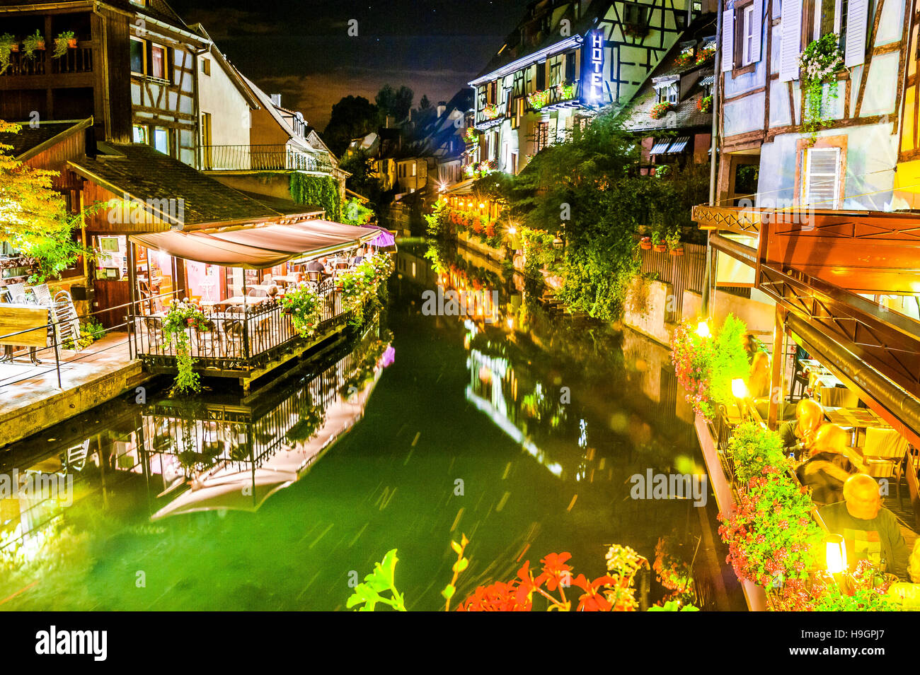 Colmar, scenic picturesque town at night with canal and reflection in ...