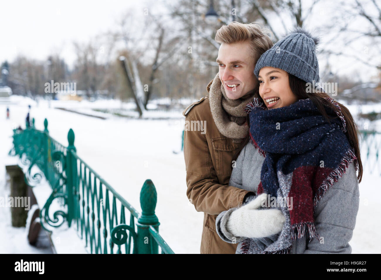 Affectionate man embracing his girlfriend in park Stock Photo - Alamy