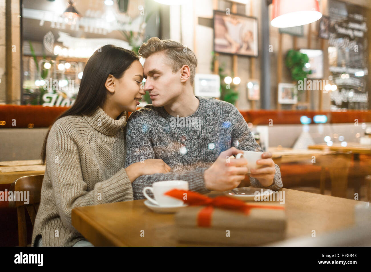 Sensual dates touching by noses while flirting Stock Photo - Alamy