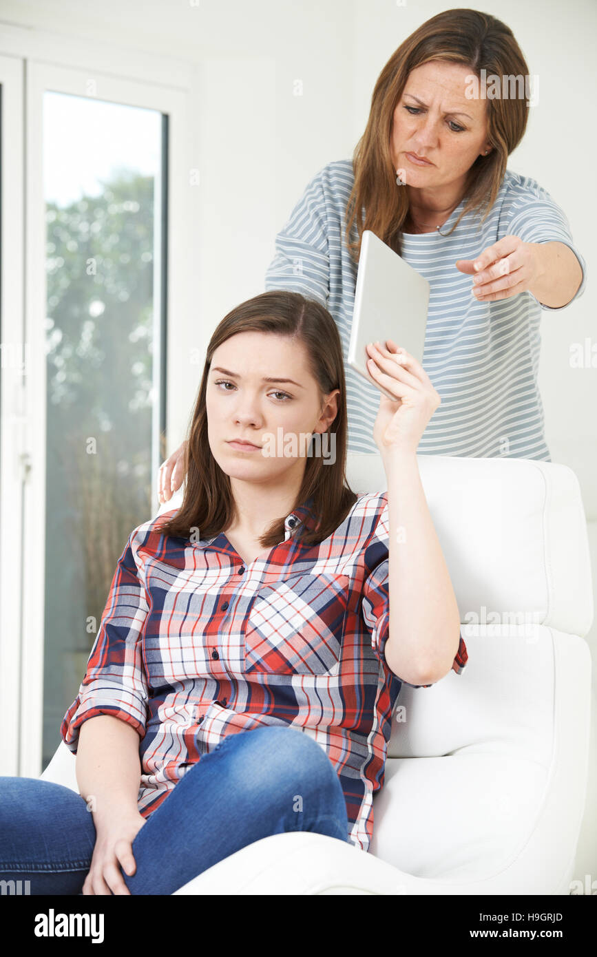 Mother Taking Digital Tablet Away From Teenage Daughter Stock Photo - Alamy