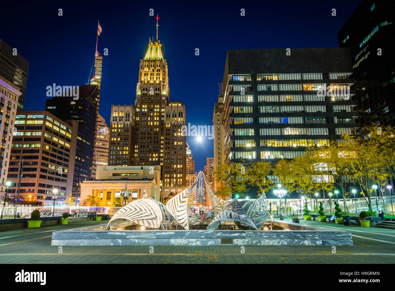 Sculpture and buildings in downtown at night, in Baltimore, Maryland ...