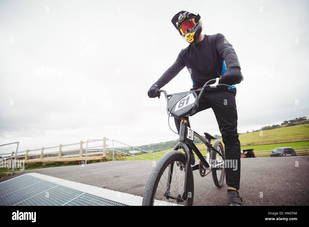 Cyclist preparing for BMX racing at starting ramp Stock Photo - Alamy