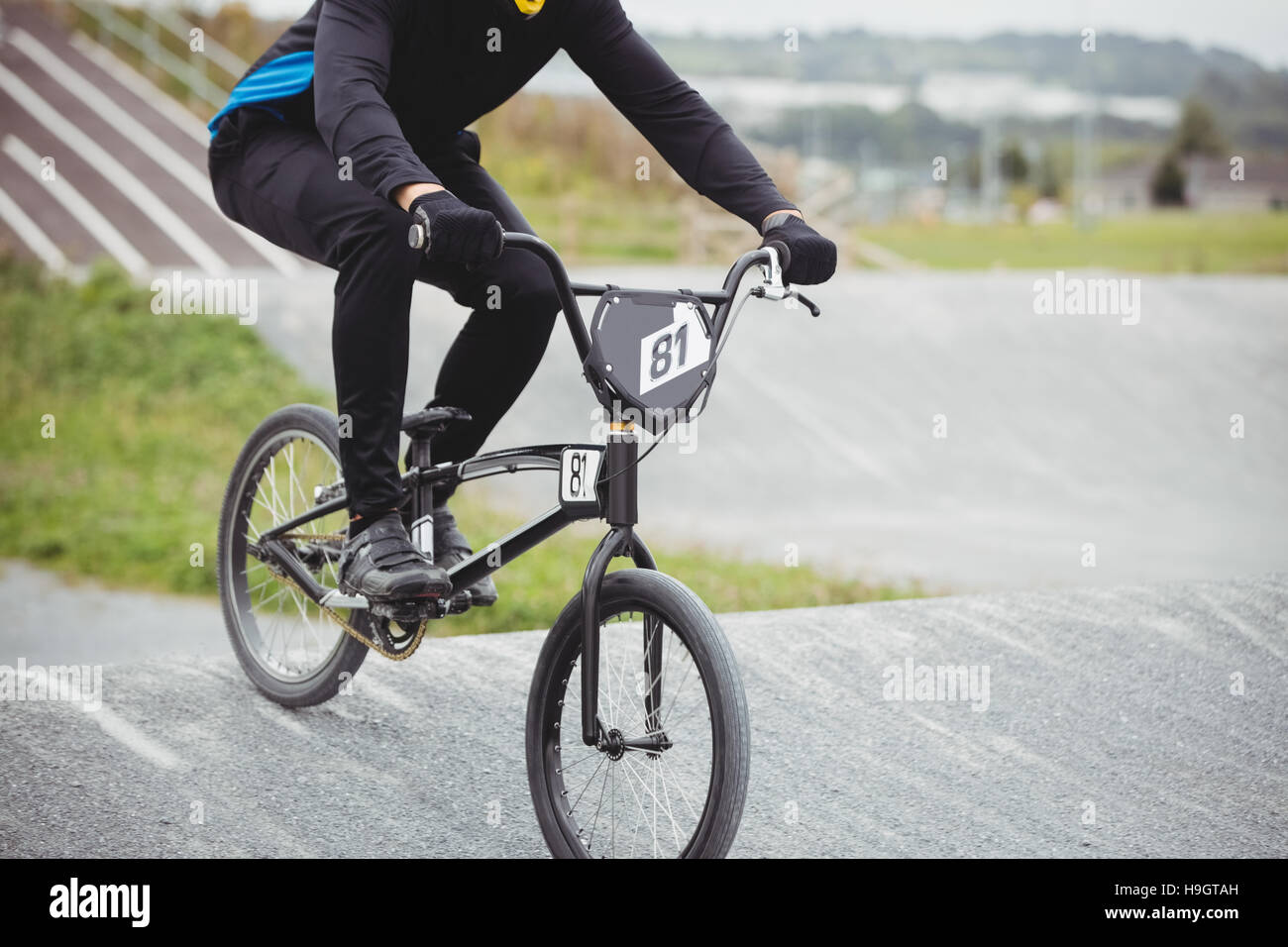 Cyclist riding BMX bike Stock Photo - Alamy