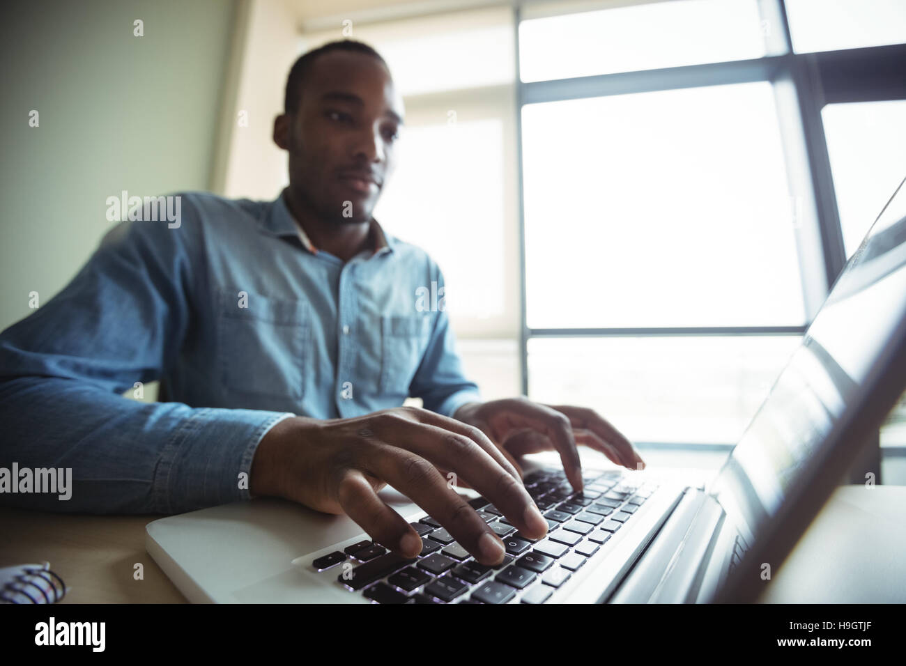 Business executive using laptop Stock Photo - Alamy