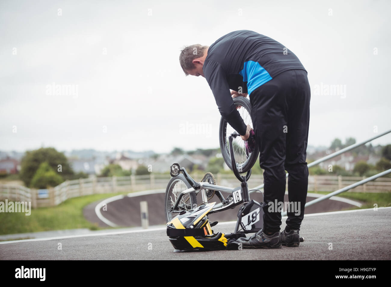 Cyclist repairing a BMX bike Stock Photo - Alamy