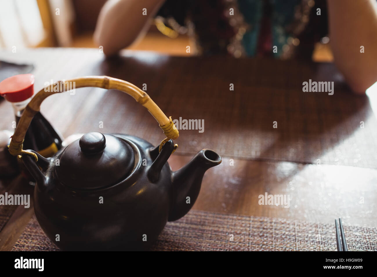 Close-up of teapot on dining table Stock Photo - Alamy