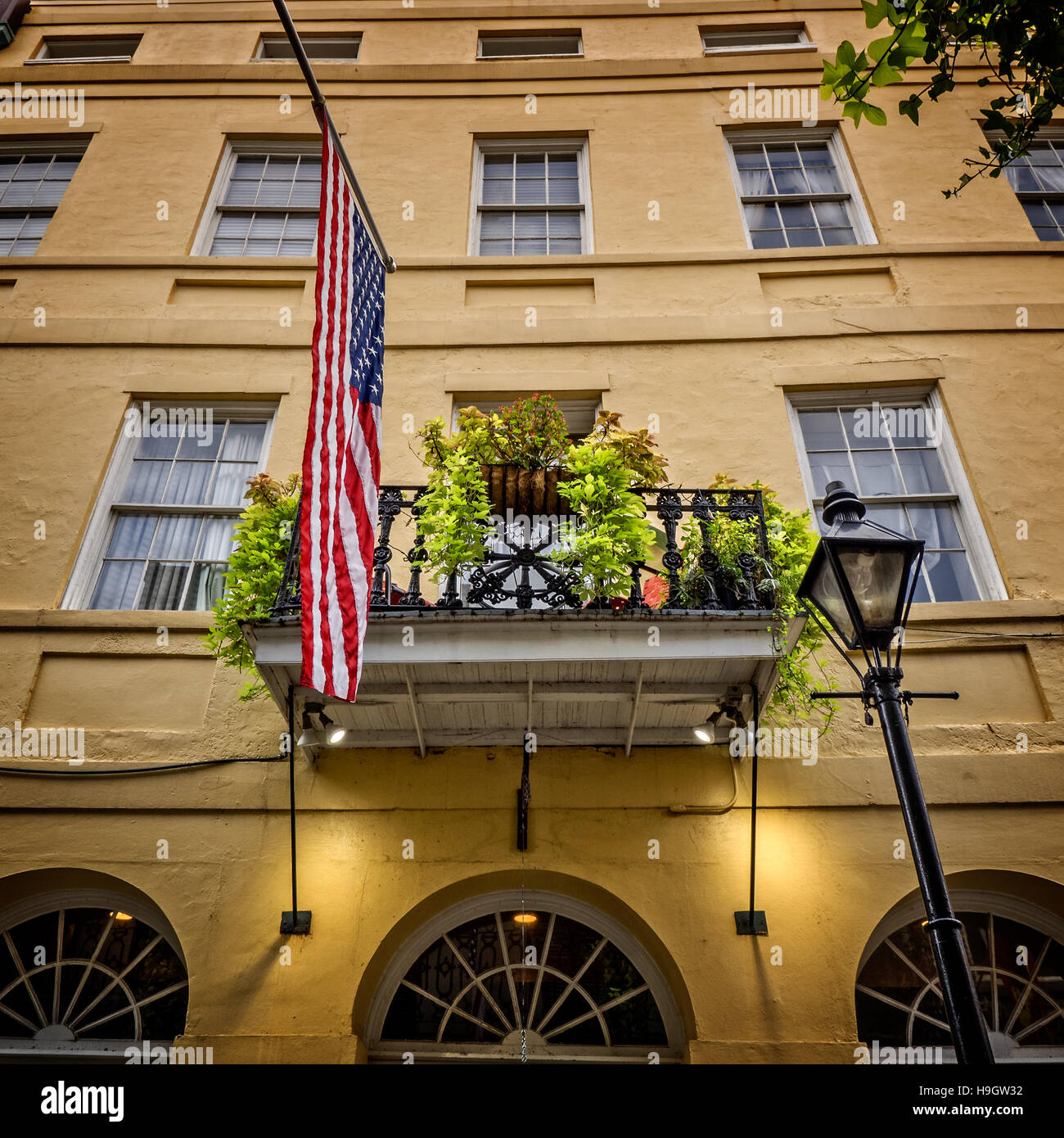 Balcony with Plants and Flag in the French Quarter of New Orleans Stock ...