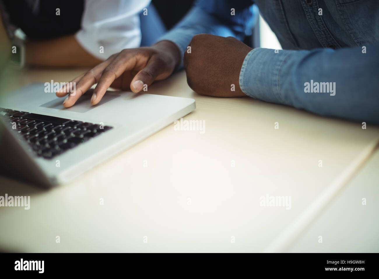 Business executives using laptop Stock Photo - Alamy