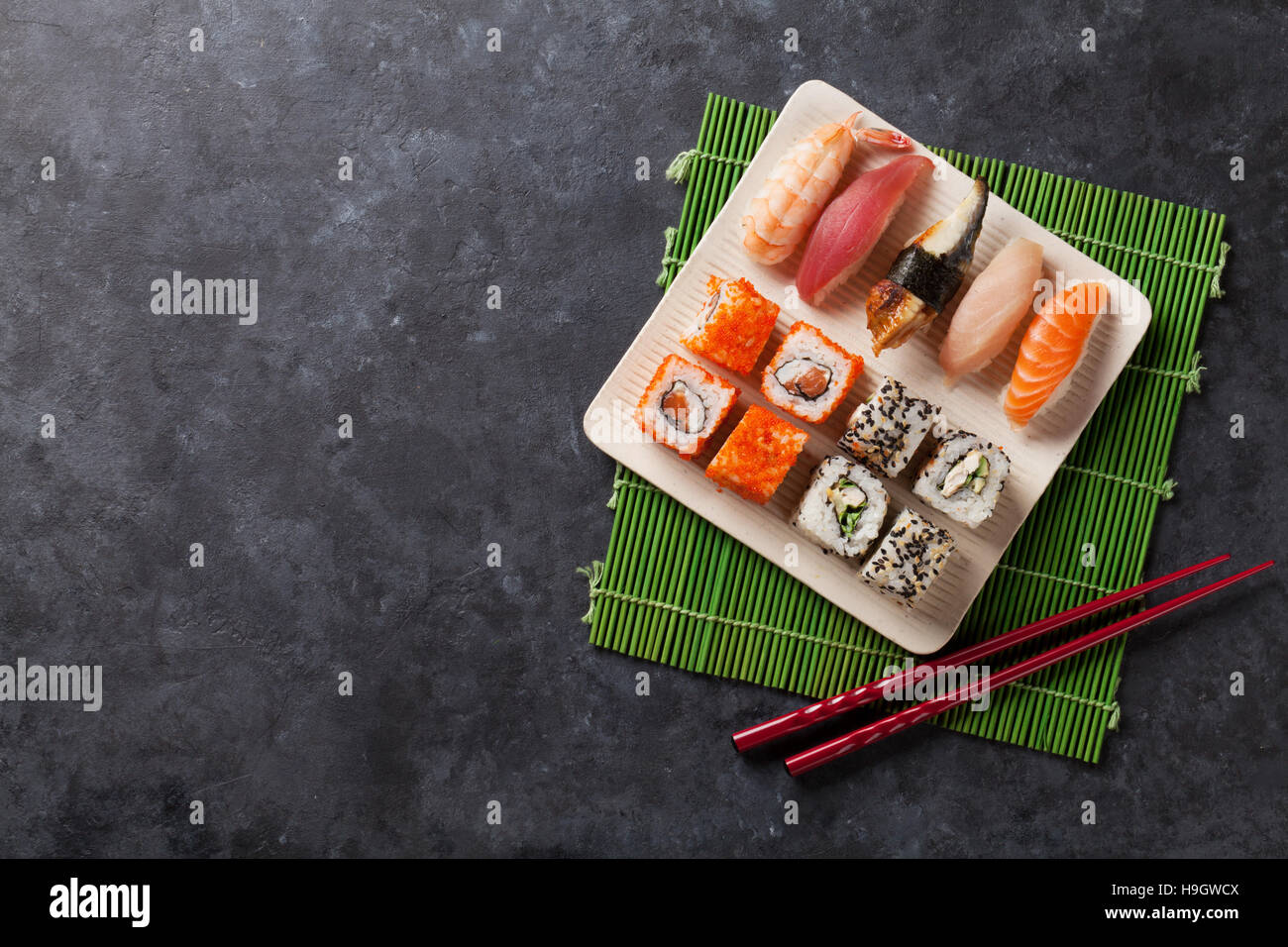 Set of sushi and maki roll on stone table. Top view with copy space ...