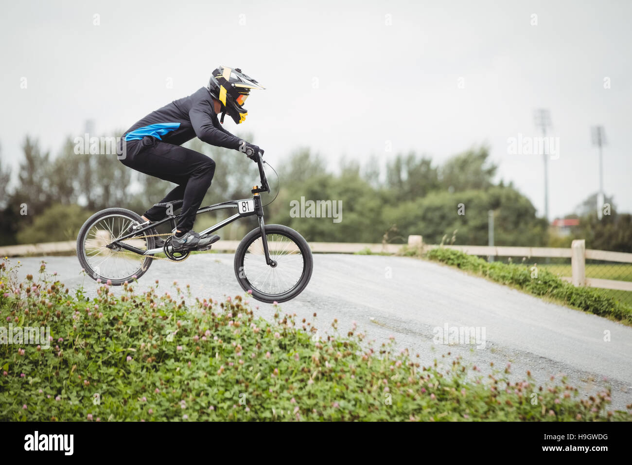Cyclist riding BMX bike Stock Photo - Alamy