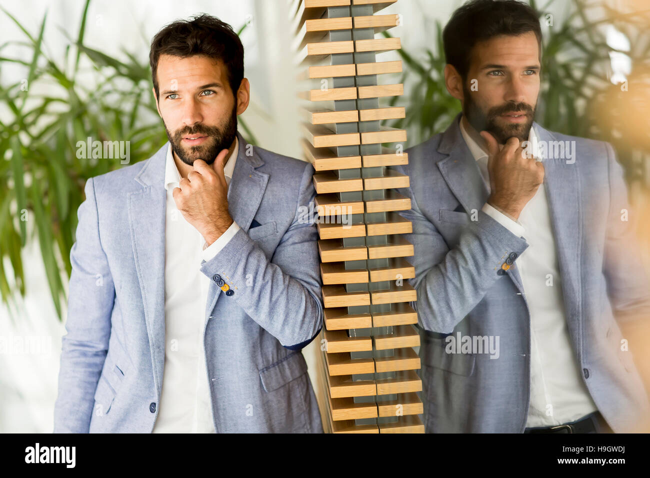 Young modern businessman posing and his reflection in the mirror Stock ...