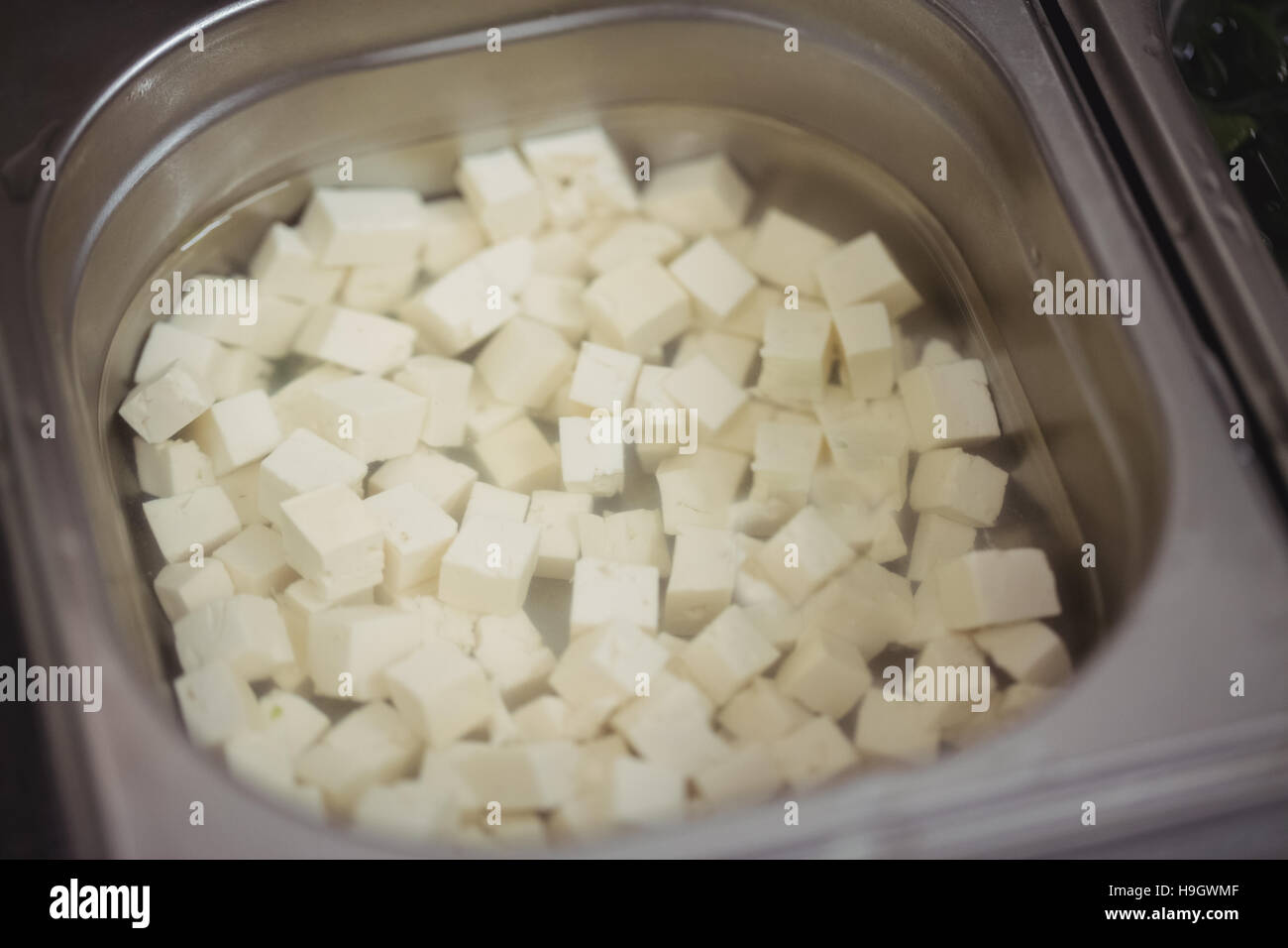 Close-up of chopped paneer in container Stock Photo - Alamy